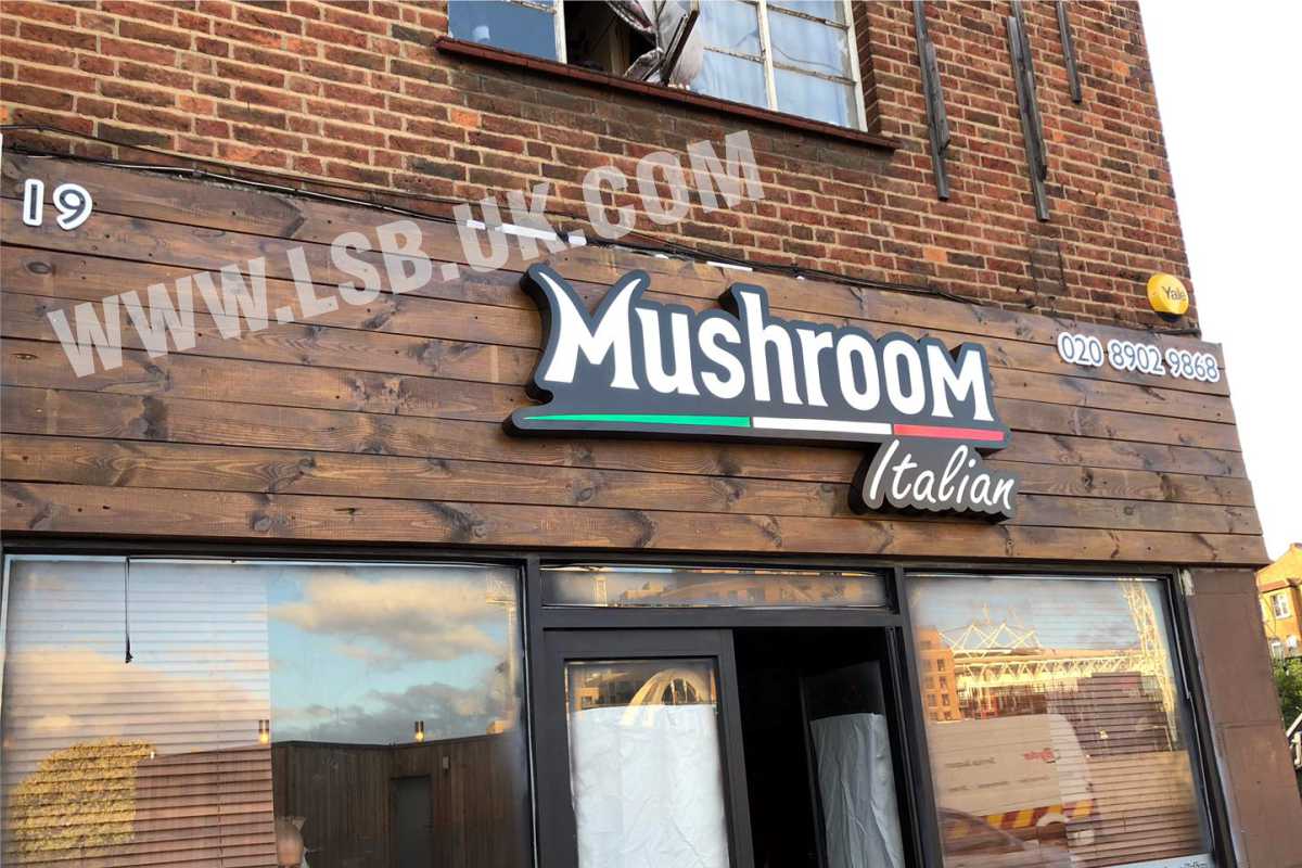 illuminated shop sign with wood background | Lion Signs & Blinds
